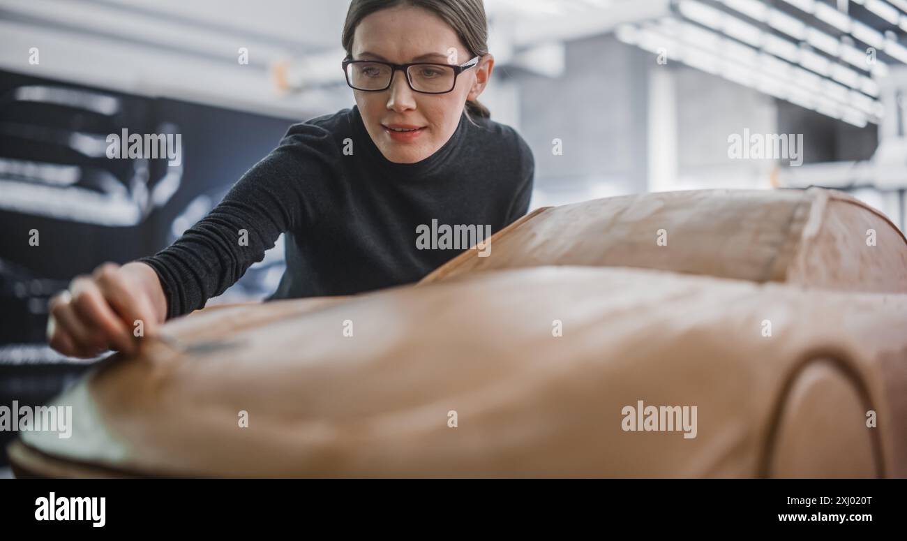 Close Up Portrait of an Automotive Designer Sculpting a 3D Clay Model ...