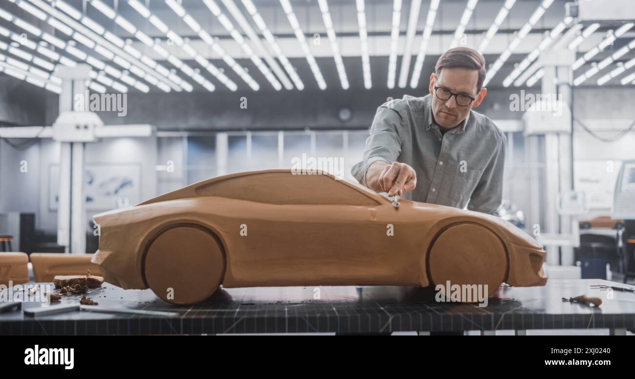 Creative Automotive Designer Working on a Prototype Car Out of Polymer ...