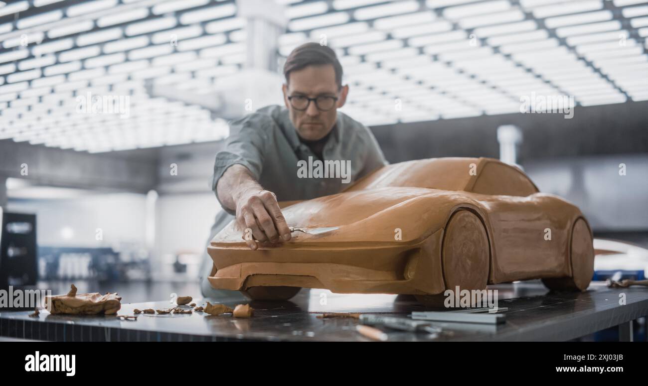 Portrait of a Handsome Automotive Designer Developing a 3D Clay Model ...