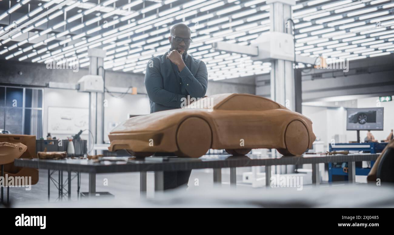Portrait of a Handsome Automotive Designer Developing a 3D Clay Model ...