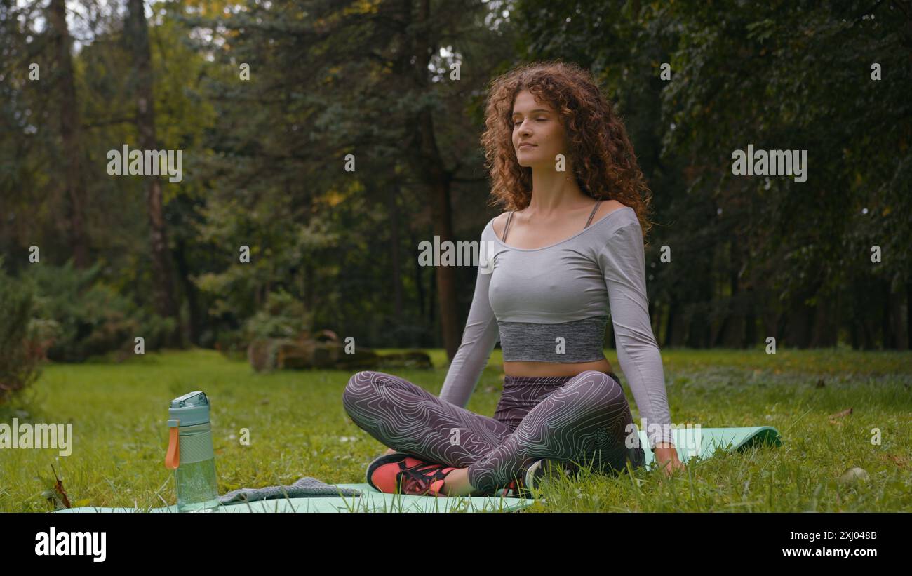 Sportive woman outdoors in park doing fitness exercise fit girl body ...