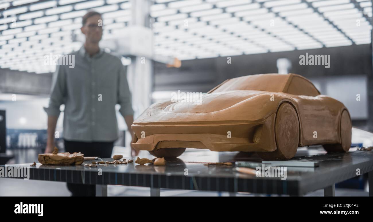 Car Modeler Entering Creative Workplace to Work on a Concept Car Made ...