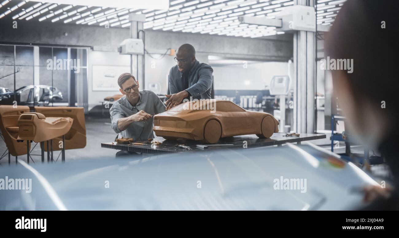 Team of Automotive Designers, Modelers and Engineers Working on ...