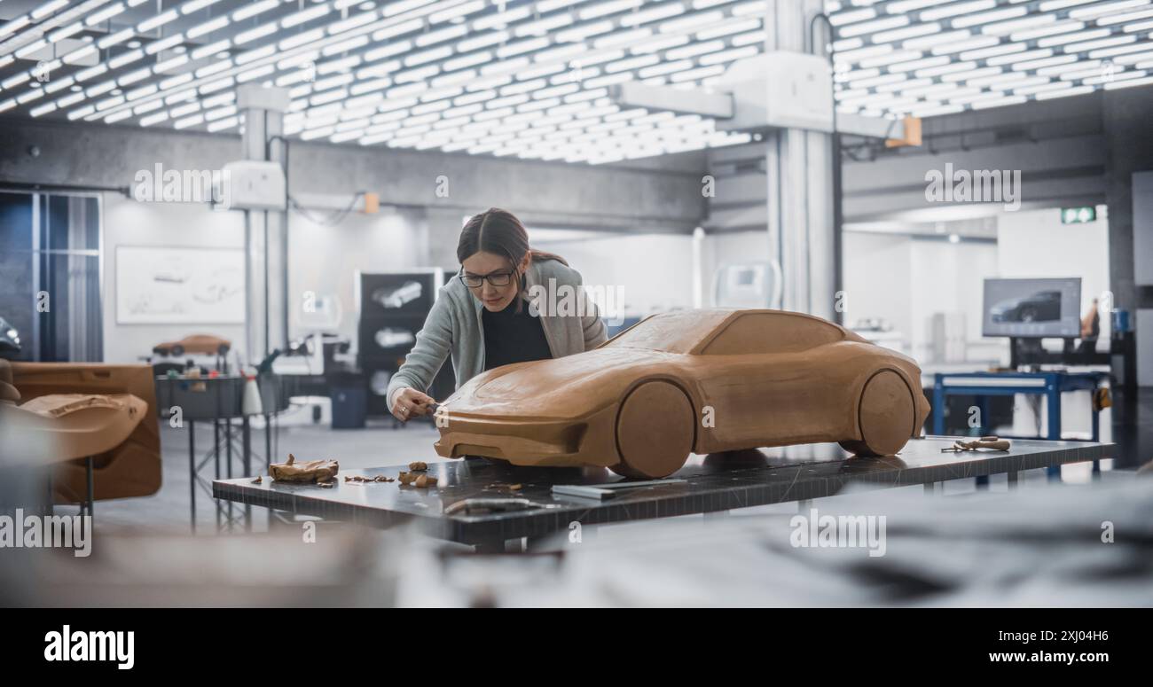 Car Modeler in Creative Workplace Working on a Concept Car Made Out of ...