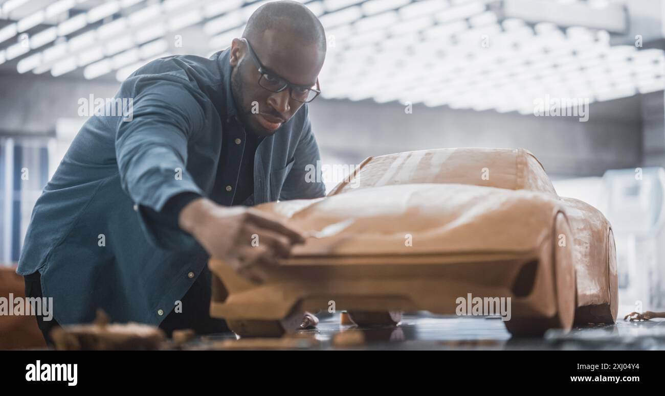 Portrait of a Handsome Automotive Designer Developing a 3D Clay Model ...