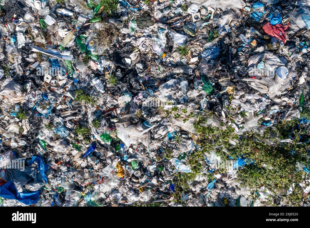 Aerial top view of large urban landfill filled with various types of ...