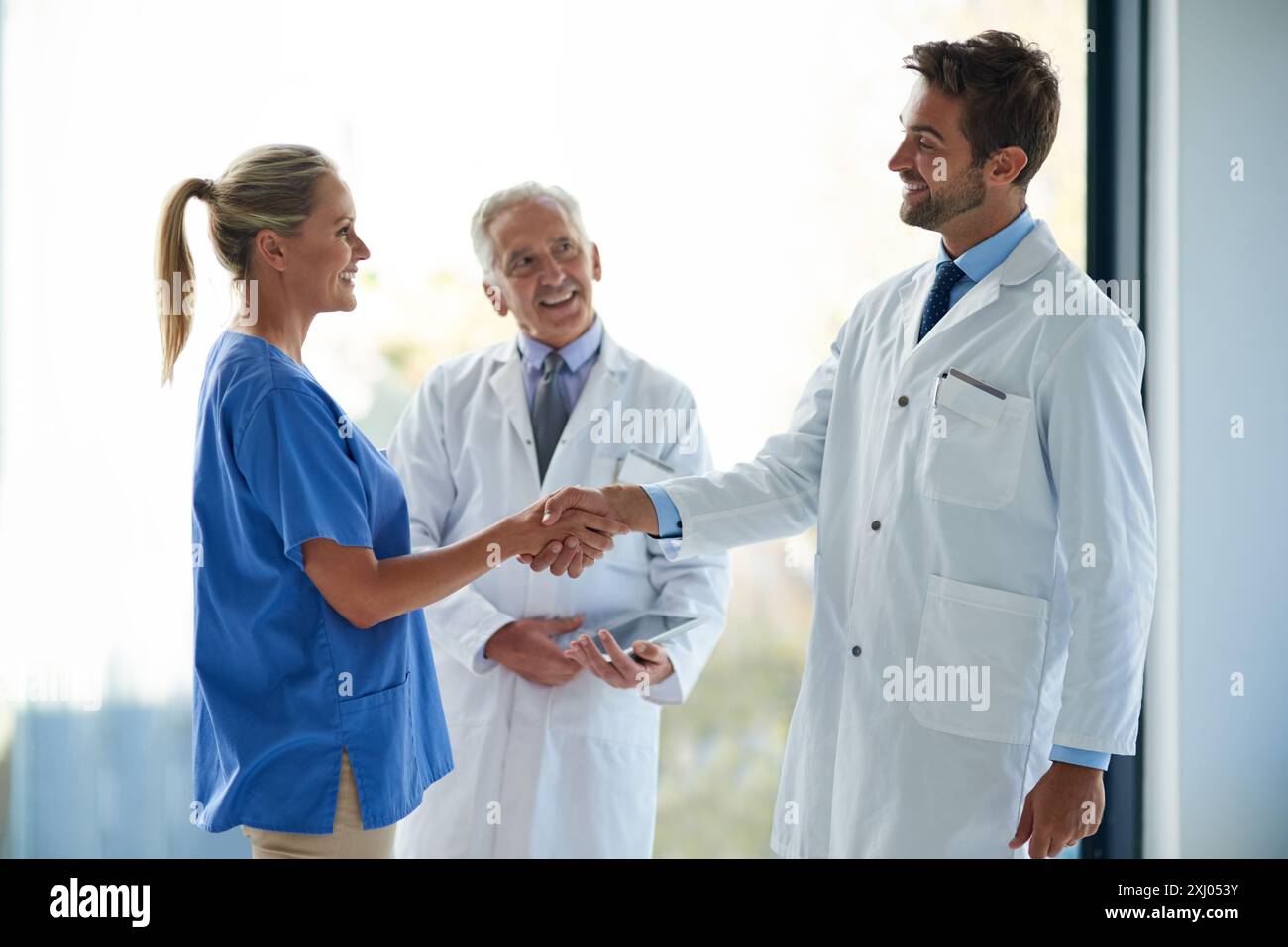 Healthcare, teamwork and medical people with handshake for greeting ...