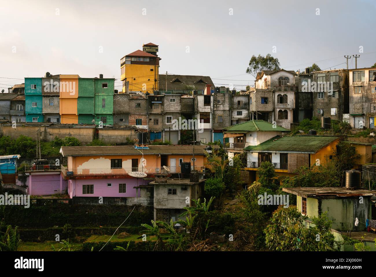 Colorful residential buildings in a hillside neighborhood showcasing ...