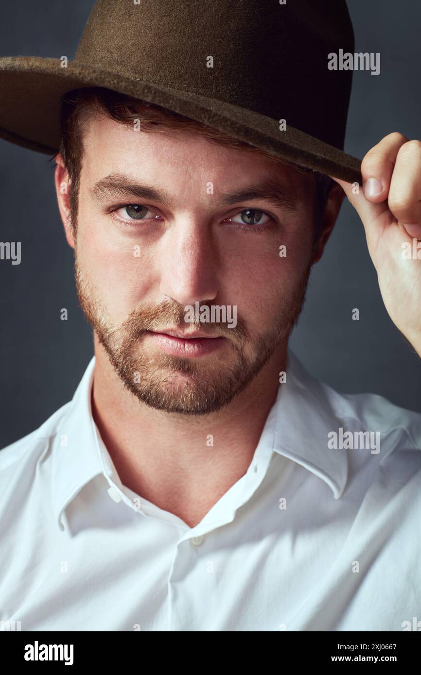 Portrait, serious and man in studio, hat and professional for actor ...