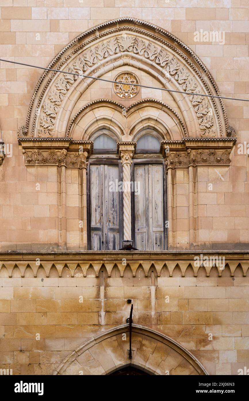 Historic Stone Building With Arched Wooden Door and Windows Stock Photo ...