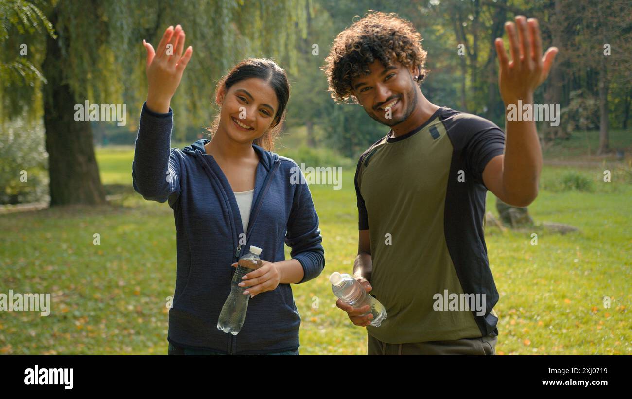 Smiling friends water bottles talking hi-res stock photography and ...