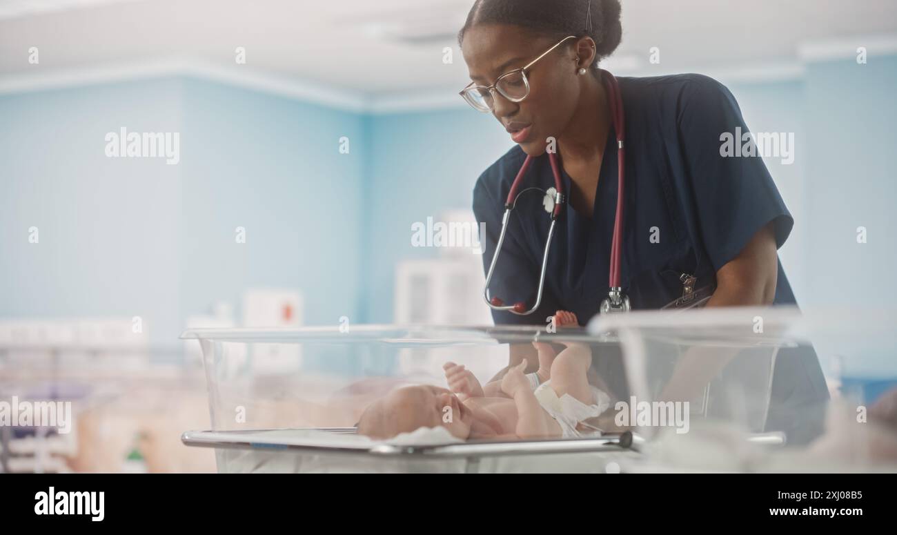 Maternity Hospital Ward: Friendly Black Head Nurse Taking Care of a ...