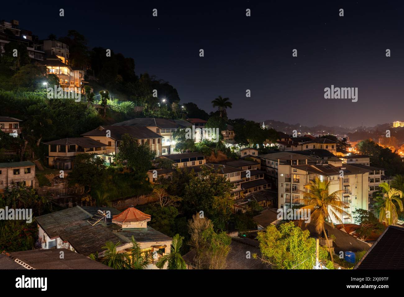 A night view of Kandy, Sri Lanka. The city is illuminated by lights ...
