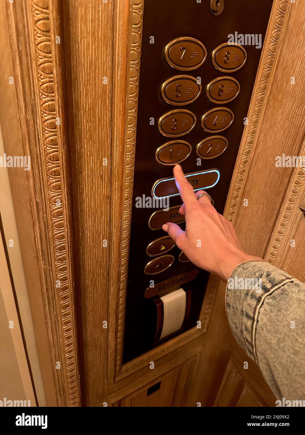 Pressing button in elevator hi-res stock photography and images - Alamy