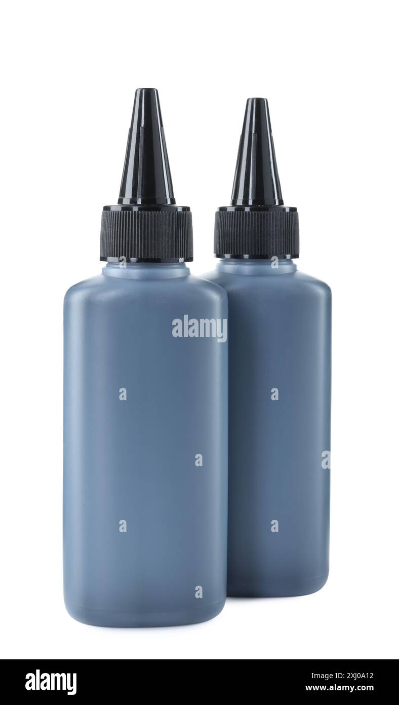 Bottles of black printer ink isolated on white Stock Photo - Alamy