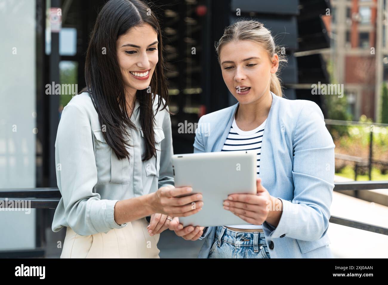 Two successful business people, colleagues and coworkers, finance and ...