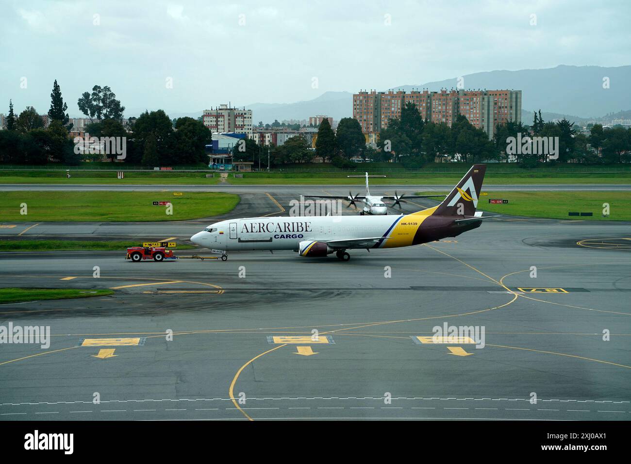 BOGOTA, COLOMBIA - JULY 11 2024 - el dorado airport operations with airplans and cargo and ...