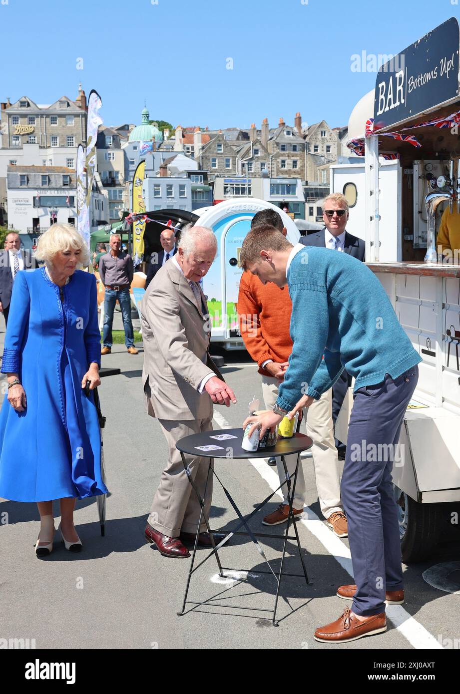 King Charles III and Queen Camilla ample some local produce at the bar ...