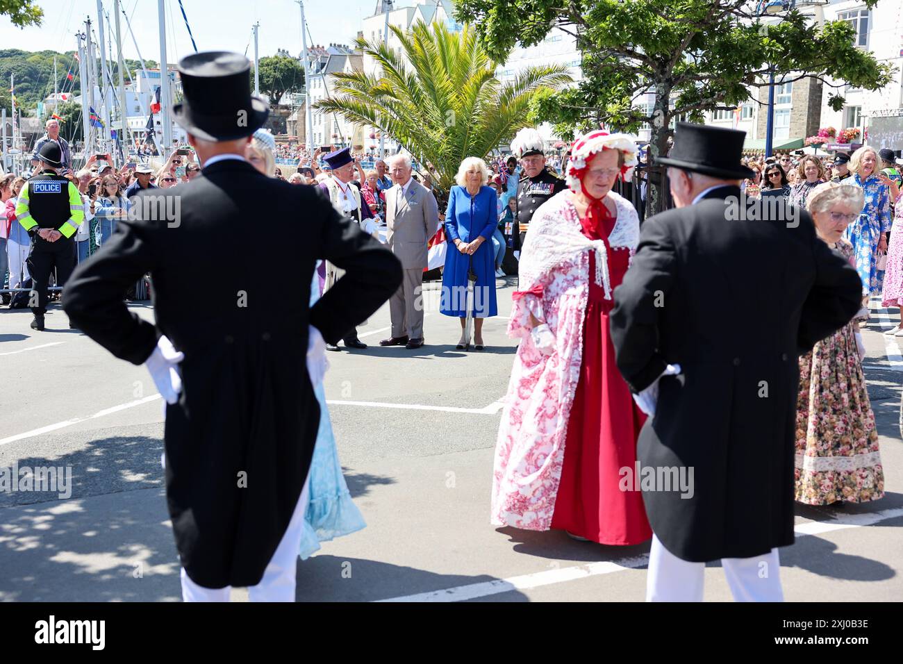 King Charles III and Queen Camilla watching the Guernsey Dancers while ...