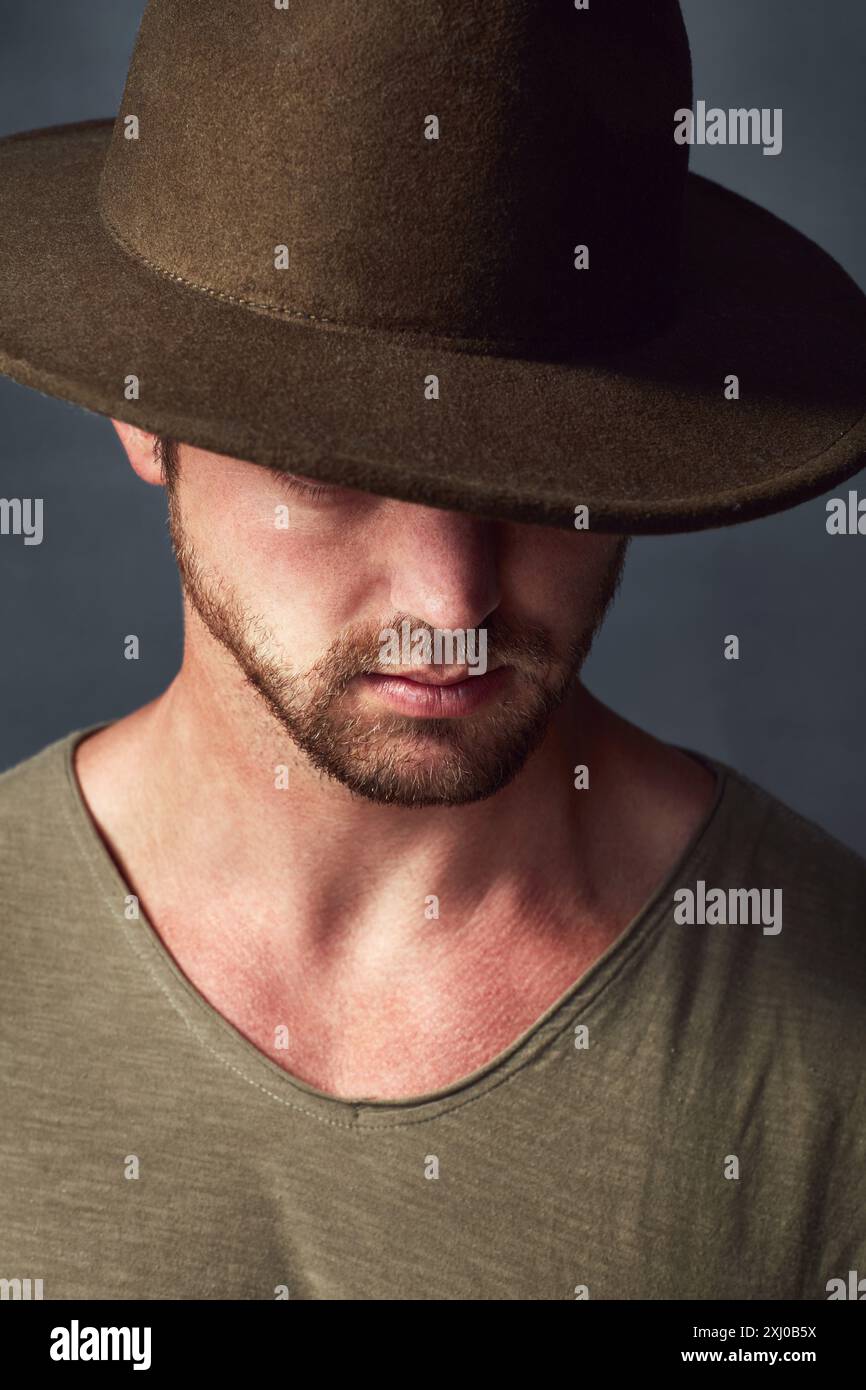 Cover, serious and man in studio, hat and professional for actor with ...