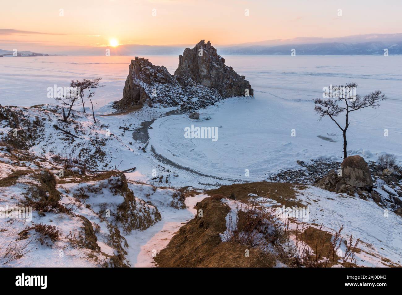 Shamanka rock in winter in the evening. Olkhon island, Baikal lake ...