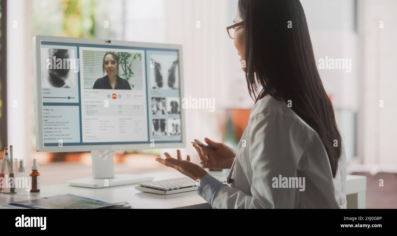 Online Medical Consultation in Doctor's Cabinet: Asian Physician Making ...