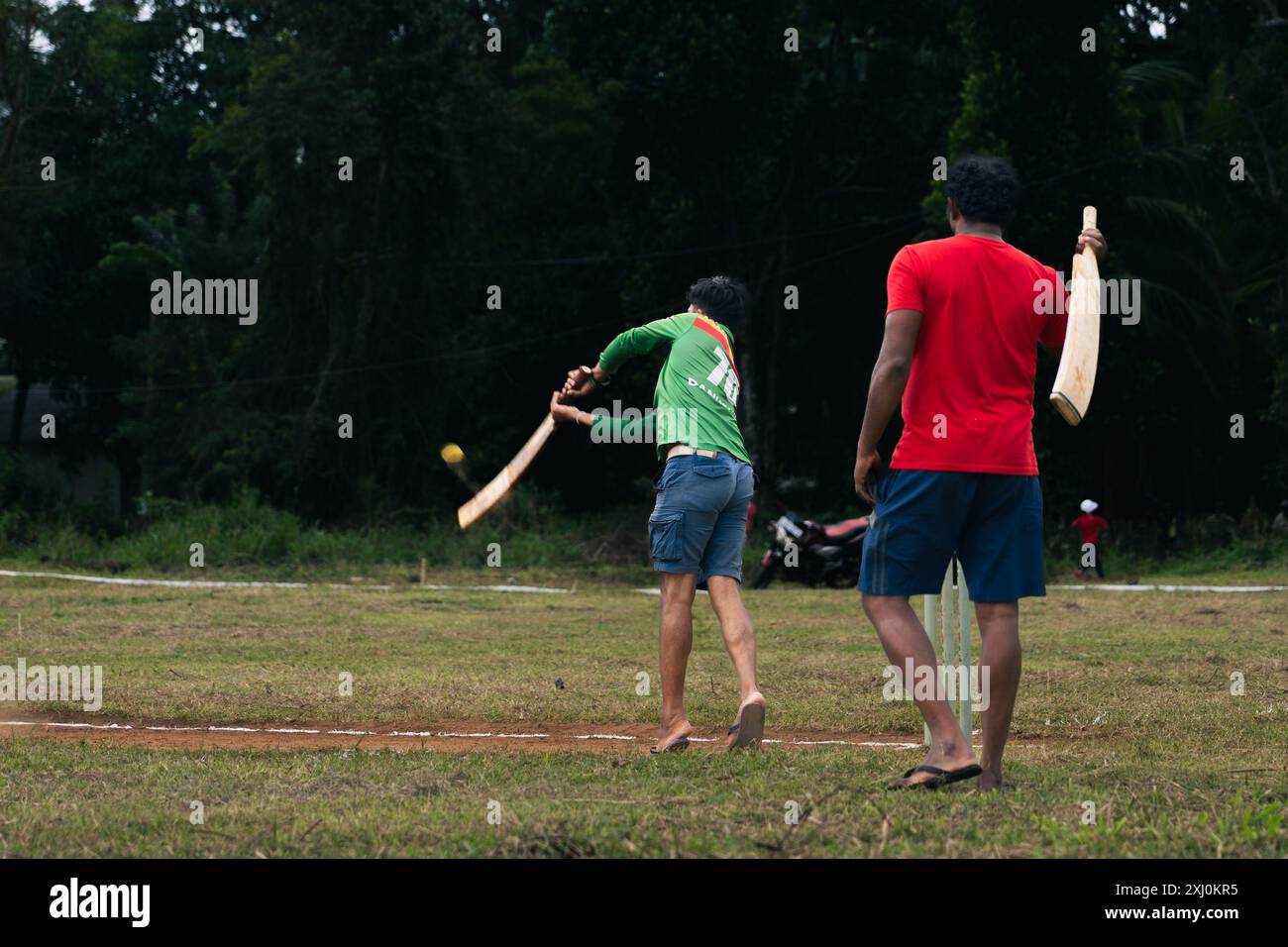 Sri Lankan young village people playing cricket. Sri Lanka, Sigiriya ...