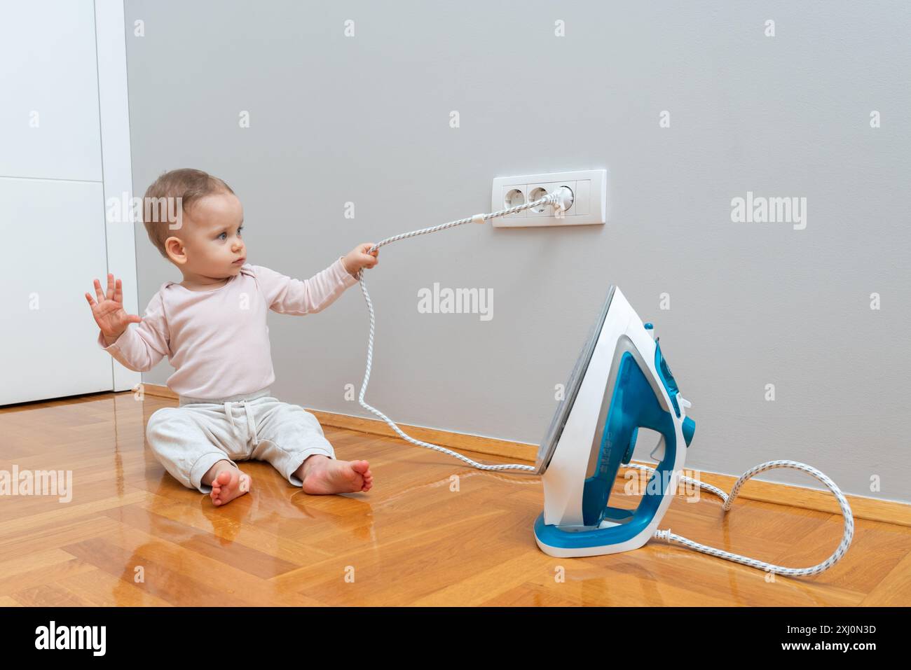 The child pulls the electrical plug out of the socket and turns off the ...