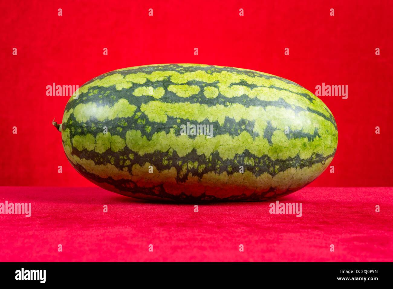 fresh watermelon on red horizontal composition Stock Photo - Alamy