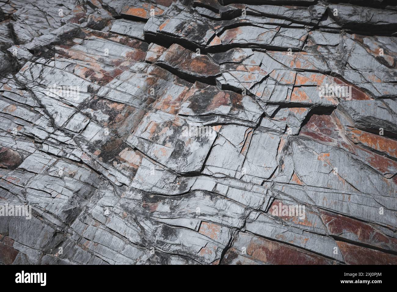 detailed closeup of beautiful grey slate rock formation texture with ...