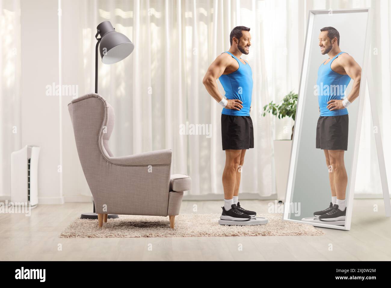 Fit man in sportswear standing on a weight scale and looking at a ...