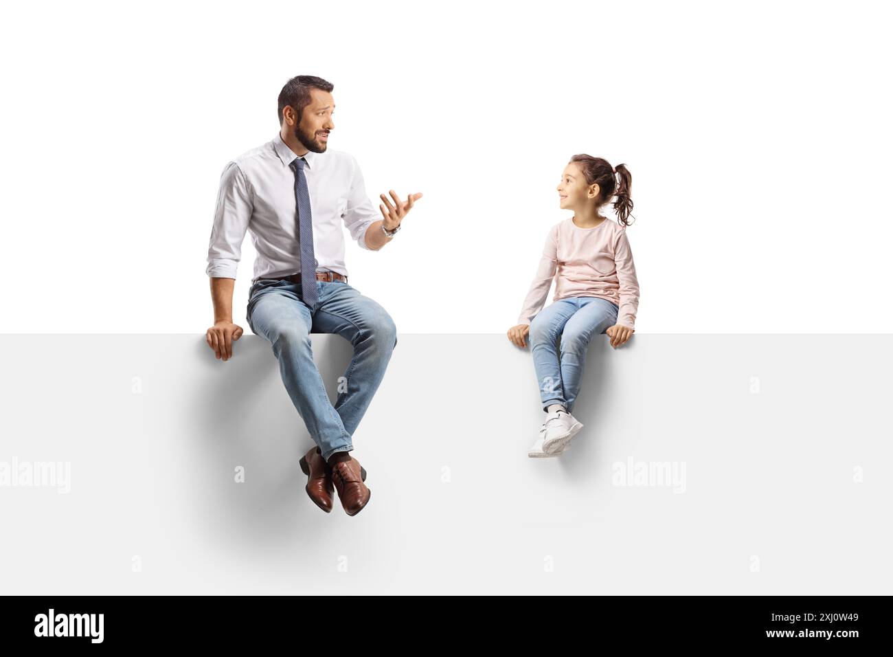 Father sitting on a panel and talking to young daughter isolated on ...