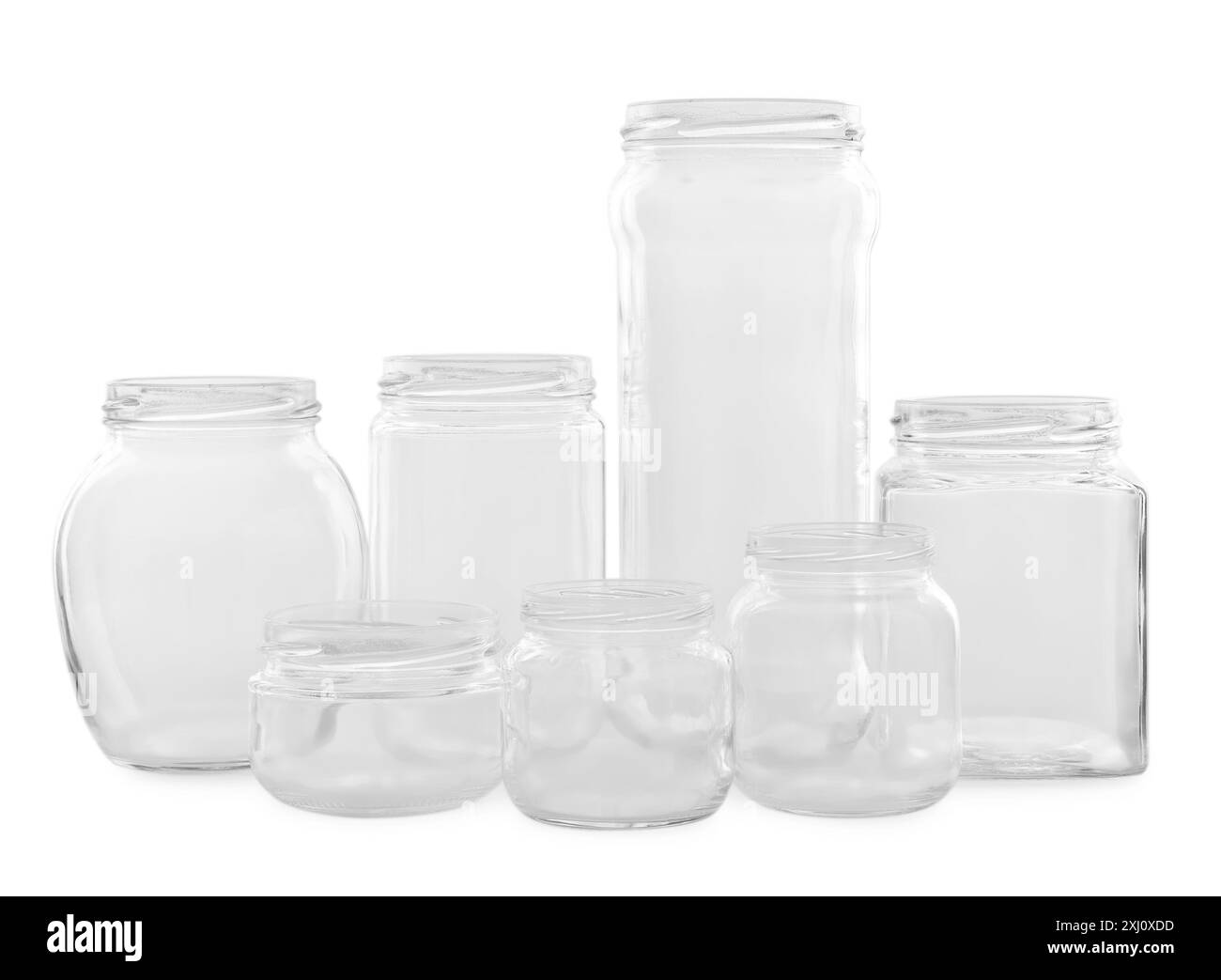 Many empty glass jars isolated on white Stock Photo - Alamy
