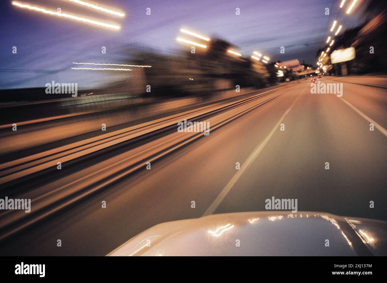 Night drive. Driving a car on highway at night. POV view - silver car ...