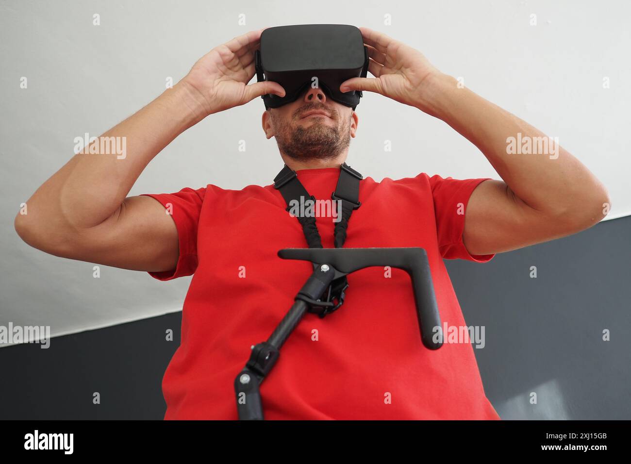 Man playing Virtual Reality shooters game with gunstock. Rifle ...