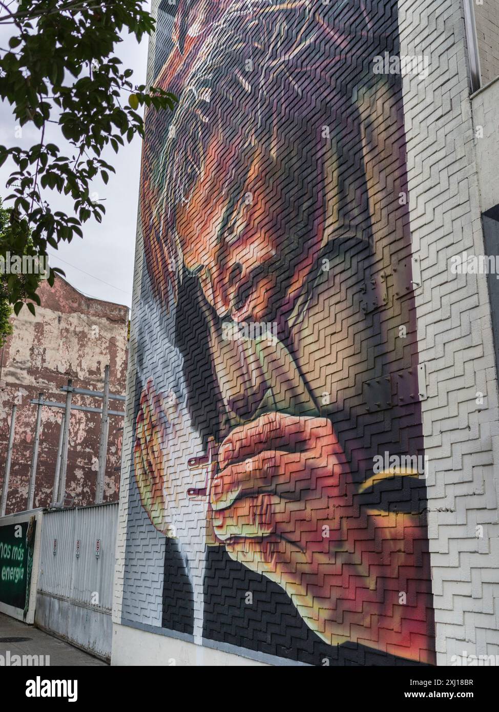 Drawing on the exterior brick wall of a building in Mexico City, Mexico ...