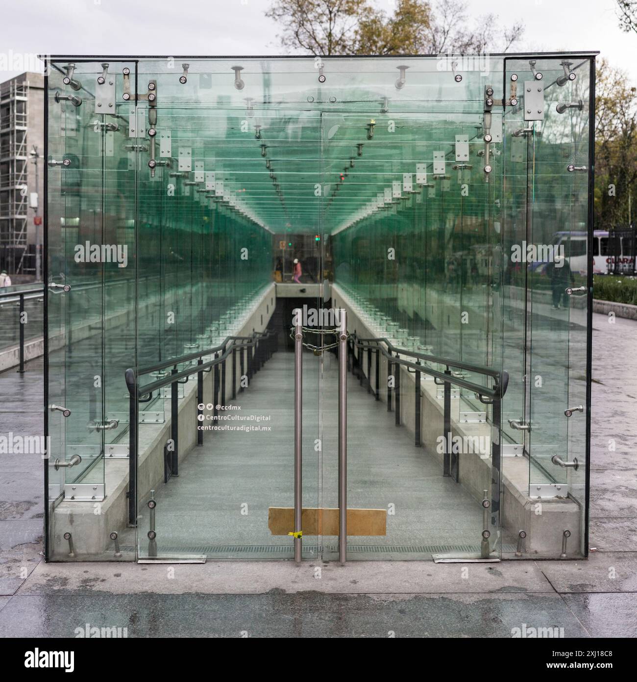 Glass enclosed slopped walkway on a street in Mexico City, Mexico Stock ...