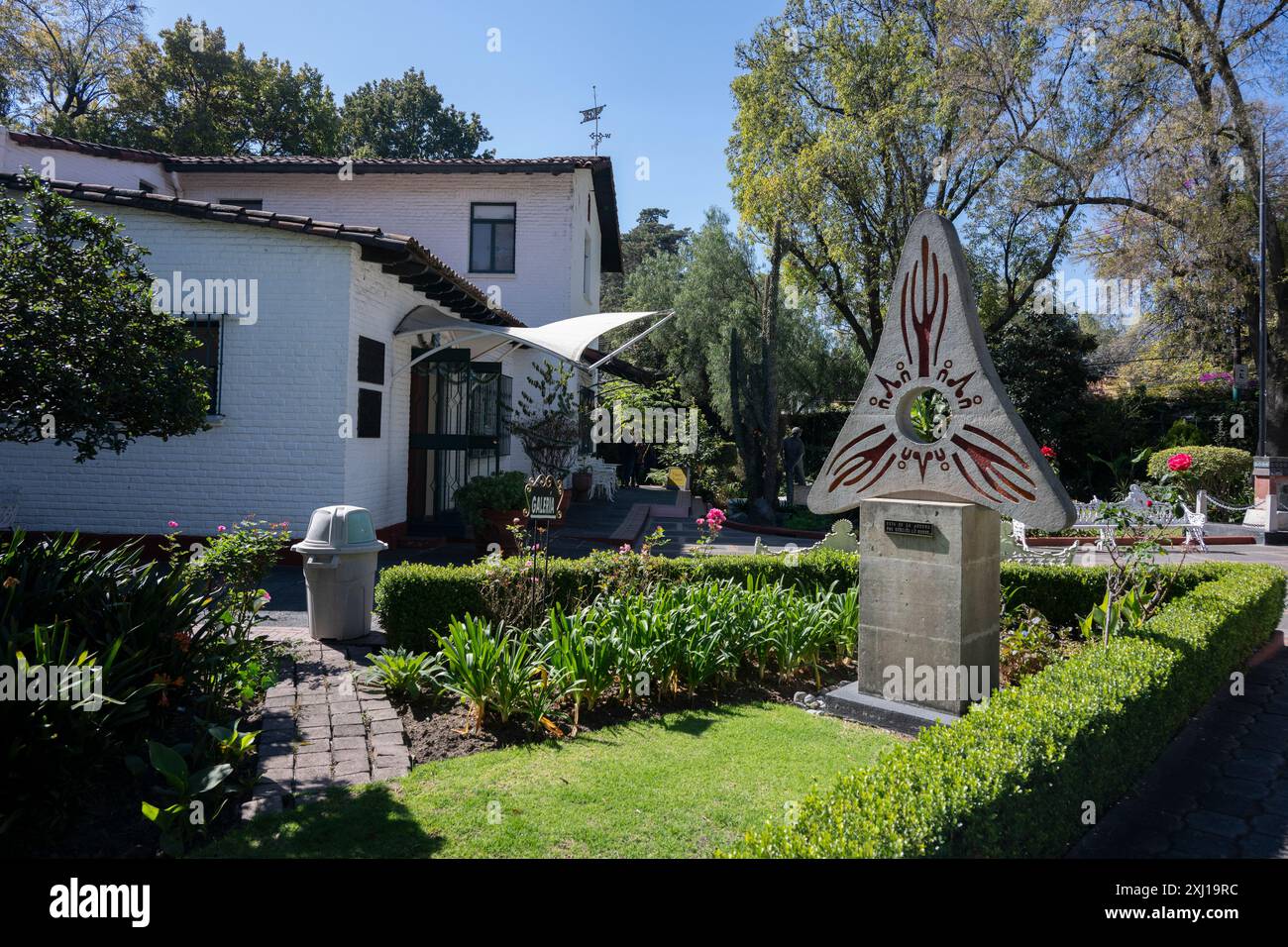 Sculpture on a pedestal on a lawn in front of the The Alfredo Guati ...