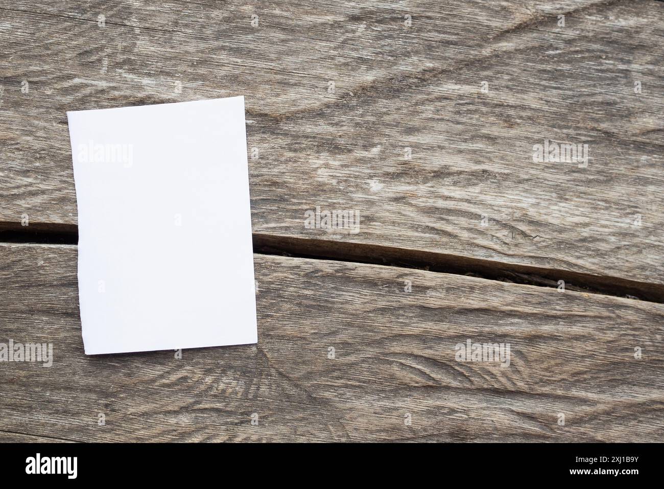 Blank white paper on old rustic wood table background Stock Photo - Alamy