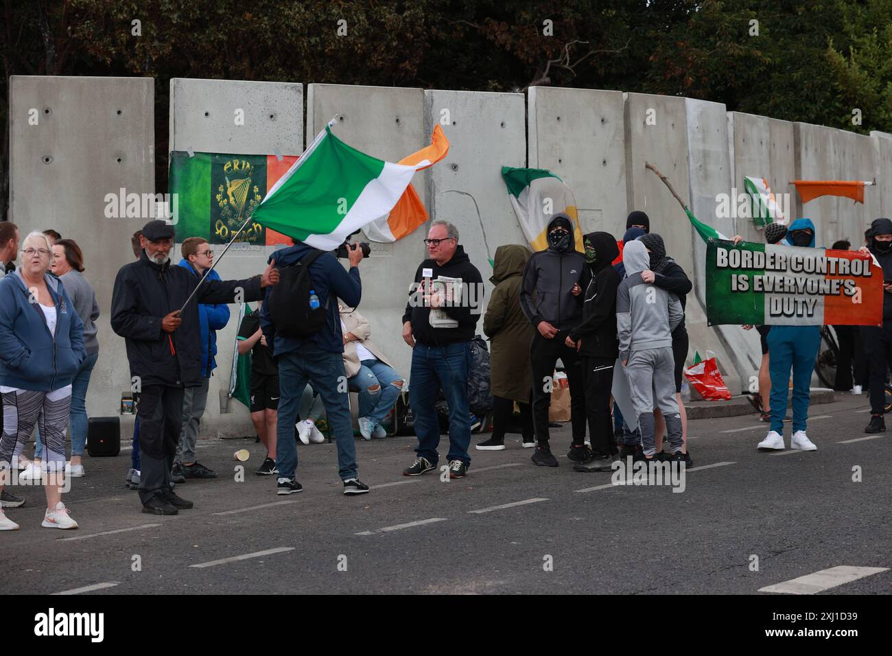 Protesters gather at the former Crown Paints factory in Coolock, north ...