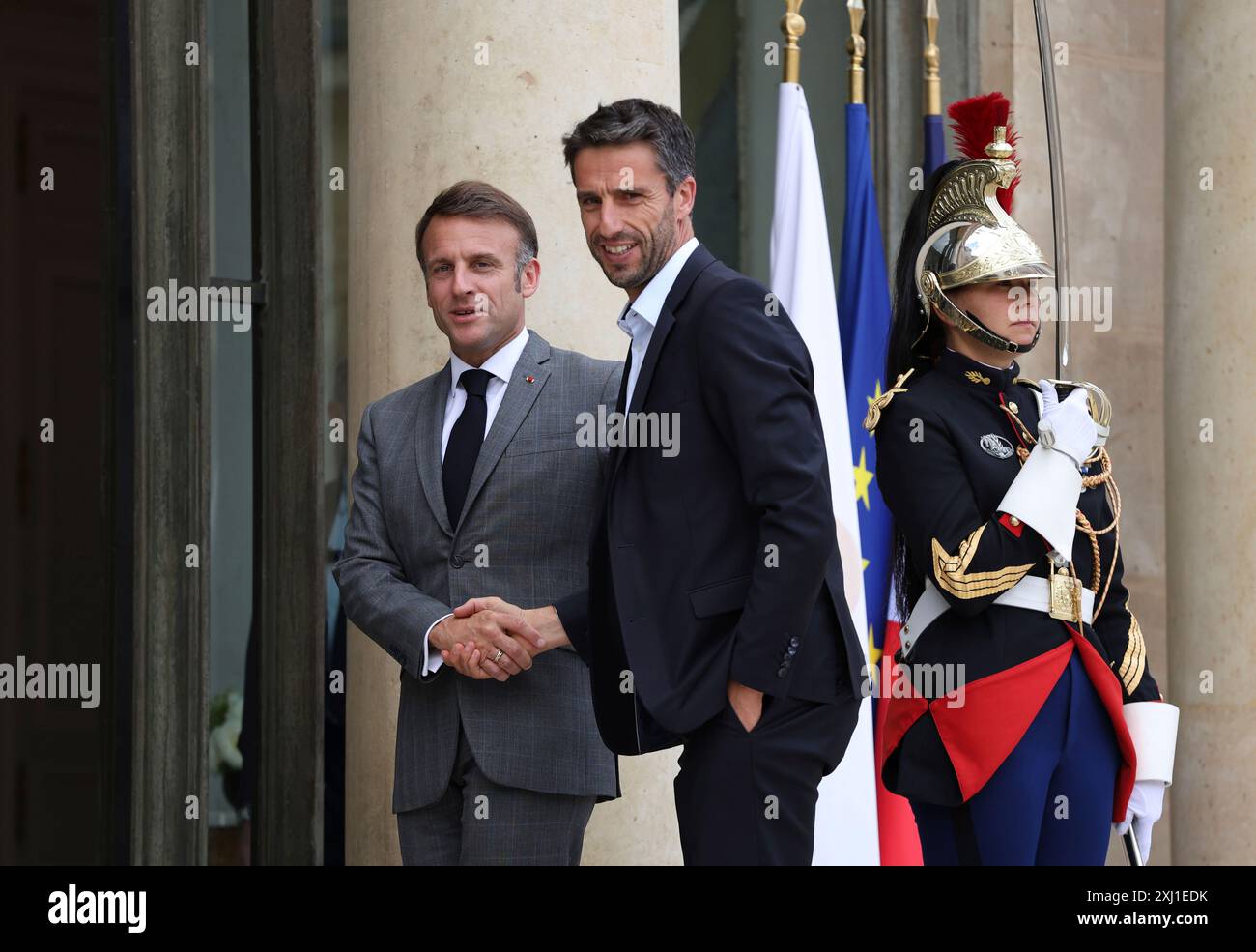 French President Emmanuel Macron, left, welcomes Tony Estanguet ...