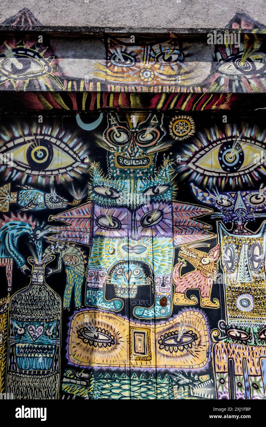 Various drawings and sketches on the exterior walls of a building in ...