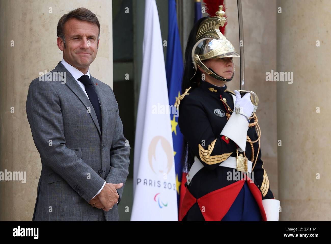 French President Emmanuel Macron waits for International Olympic ...