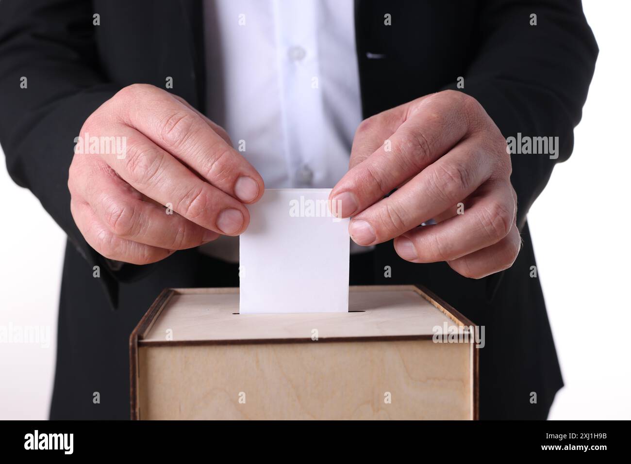 Hand putting paper ballot box hi-res stock photography and images - Alamy