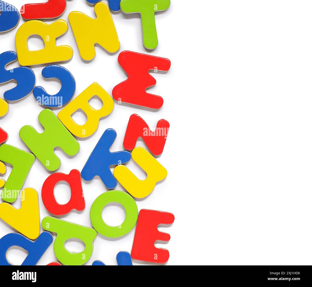 Alphabet. Many colorful magnetic letters isolated on white, top view ...