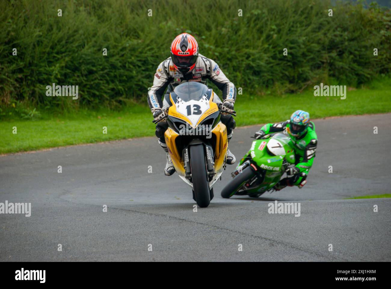 Motorcycle racing on a track Stock Photo - Alamy