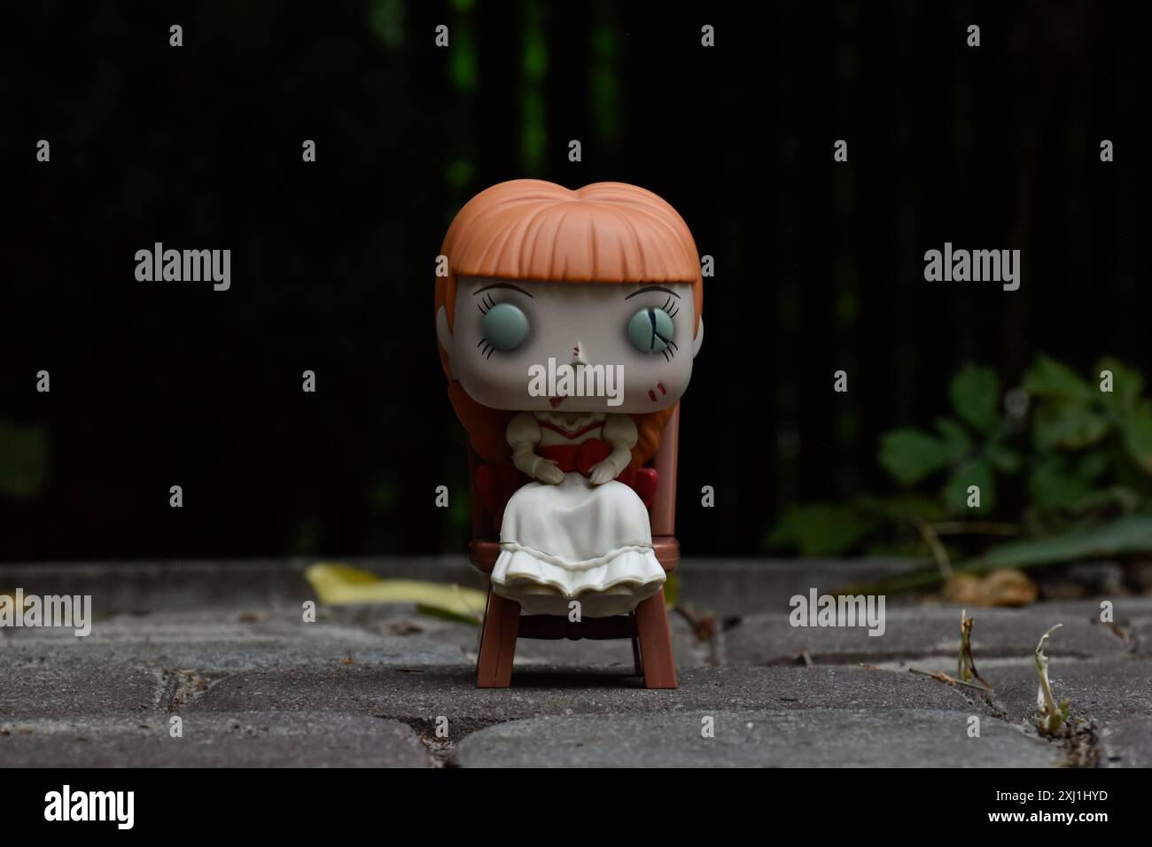 Funko Pop action figure of haunted doll Annabelle sitting on chair from ...