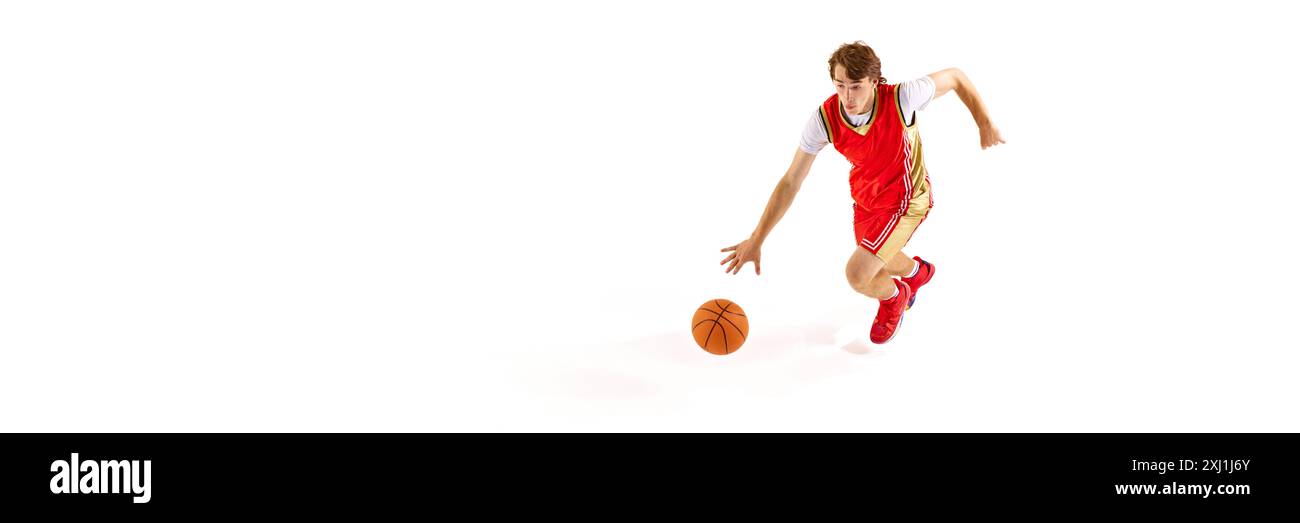 Banner. Young basketball athlete dribbling in motion against white ...