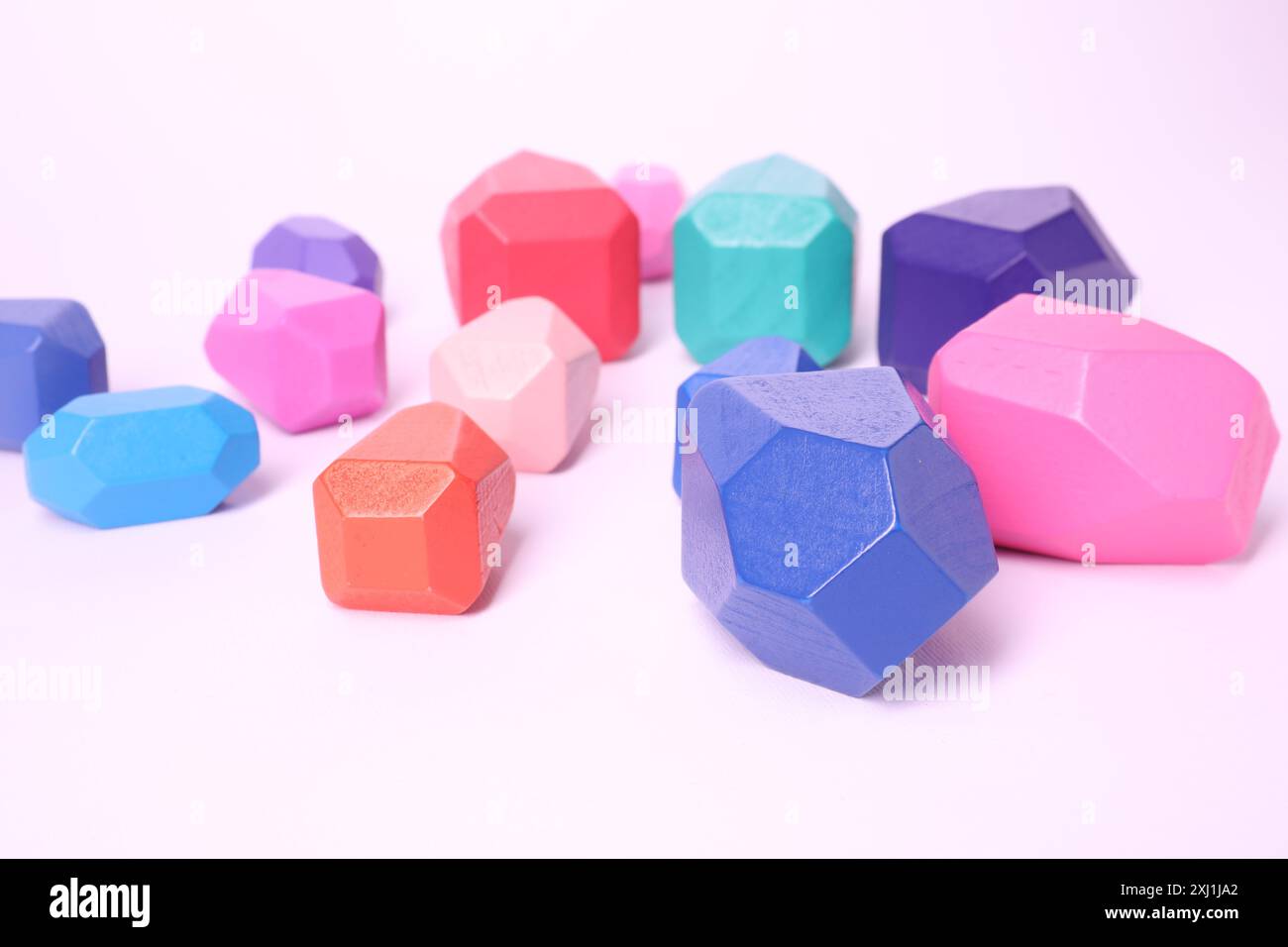 Many colorful balancing stones on white background Stock Photo - Alamy