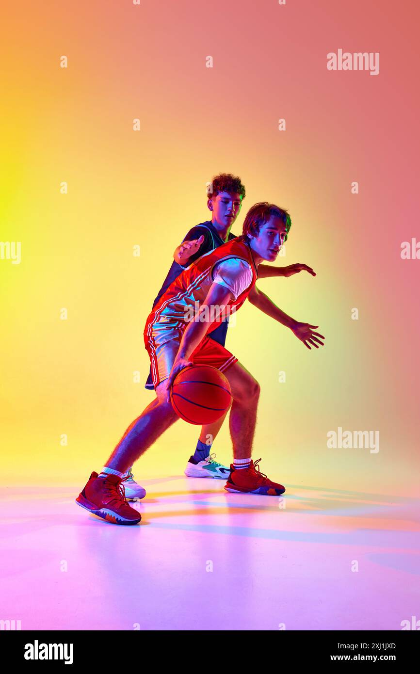 Two basketball players practice with intensity, showcasing their skill ...